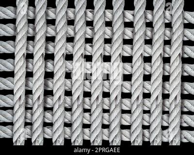Rope in the form of a grid on black background Stock Photo - Alamy