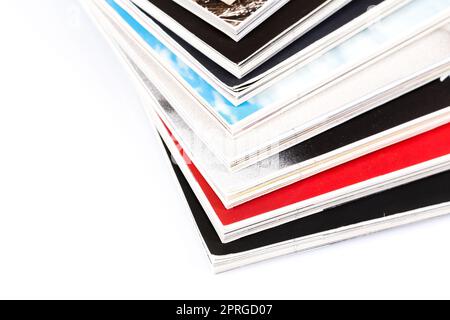Magazines up close shot on white background Stock Photo - Alamy