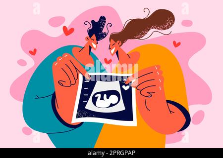 Happy couple showing picture of embryo. Smiling man and woman ...