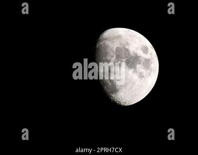 Three Quarter Full Moon Against Black Sky - 40+ MP Image Stock Photo ...