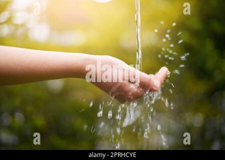 Water is such a precious commodity. hands held out to catch a stream of ...