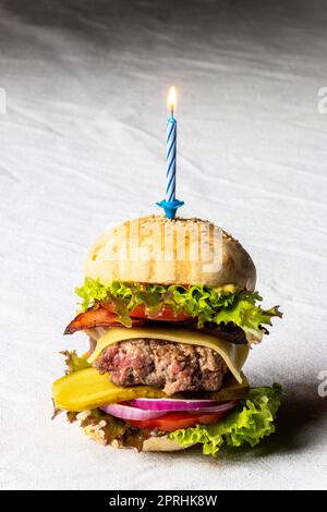 closeup of a single cheeseburger Stock Photo - Alamy