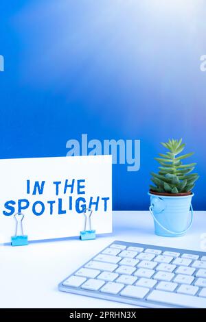 Sign displaying In The Spotlightwhen crowd concentrating with ...