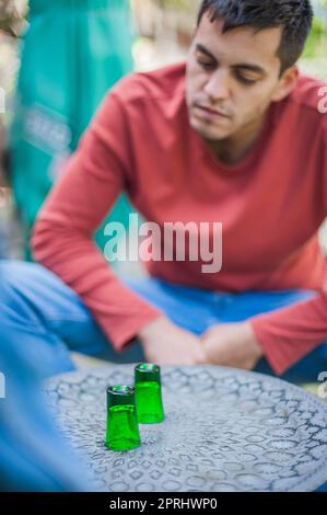 Very drunk couple, a boy and a girl, drink a strong alcoholic drink ...
