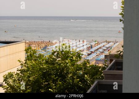 Beach with bathers in summer. Rimini, Italy, editorial image Stock ...