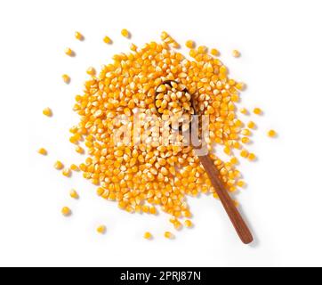 Top view of wooden spoon placed on pile of dried leaves of tea with dry ...