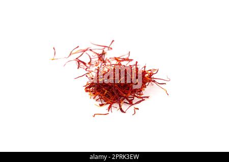 Dried saffron spice pieces isolated on a white background Stock Photo ...