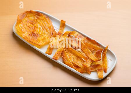 Cooked dried fish fillet snack Stock Photo - Alamy