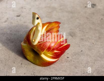 Apple swan. Decoration made of fresh fruit.Apple swan. Decoration made ...