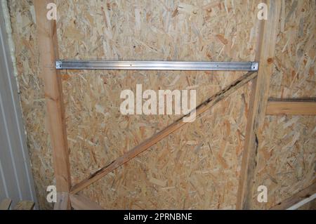 Installation of a suspended structure for drywall Stock Photo - Alamy