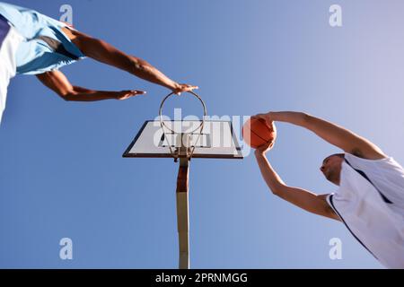 Equal opponents. Two basketball players playing a friendly game Stock ...