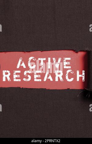 Sign displaying Active Research, Word Written on an exam that you take ...