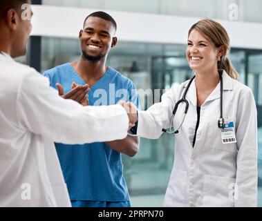 Clapping, teamwork or doctors shaking hands for success, good job or promotion goal in a ...