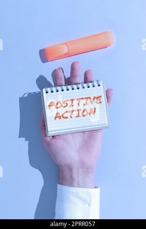 Text sign showing Positive Actiondoing good attitude against certain ...