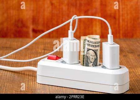 Electric extension cord and money Stock Photo - Alamy