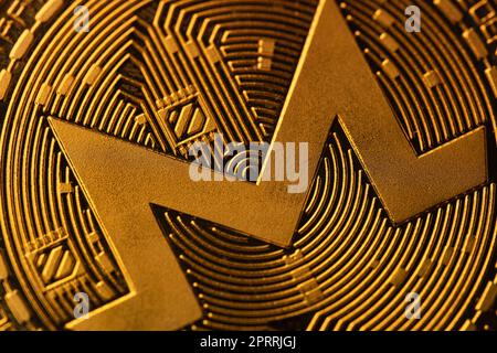 top view extreme macro closeup of crypto cardano golden coin logo ...