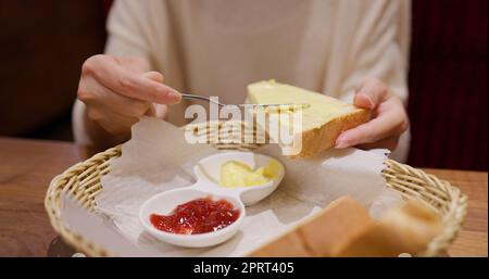Apply butter and strawberry Bread toast at coffee shop Stock Photo - Alamy