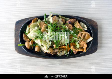 Horumon Sutamina Itame, vegetable stir fry with pork innards served on ...