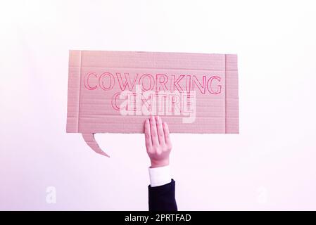 Hand writing sign Coworking Centreshared workplace often office and ...
