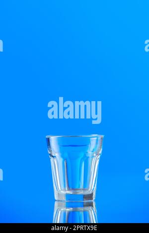 front view water glass on red isolated background Stock Photo - Alamy