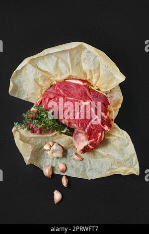 Raw beef neck wrap in paper Stock Photo - Alamy