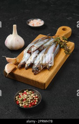 Fresh raw frozen capelin Stock Photo - Alamy