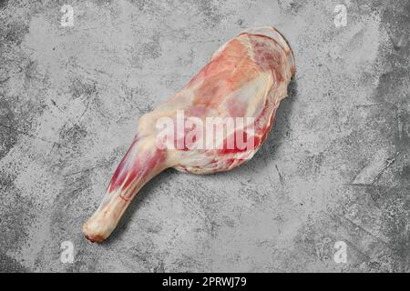 Raw lamb shoulder chump on butcher's cutting log Stock Photo - Alamy