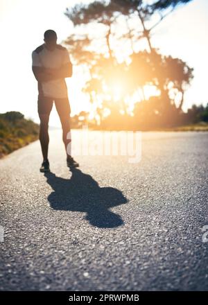 Step out of your shadow to find your strength. a young man looking ...