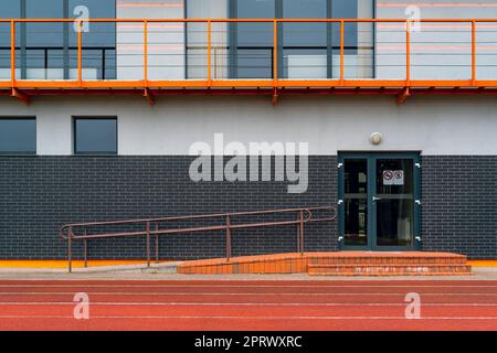 Public building entrance with a ramp for disabled person wheelchair ...
