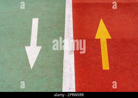 Road sign with two arrows pointing down to opposite sides Stock Photo ...