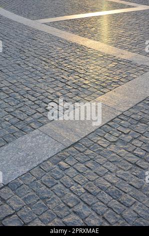 Fragment of the street square, folded out of a gray square paving stone ...