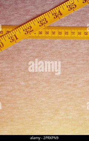 The measuring tape of yellow color with numerical indicators in the ...
