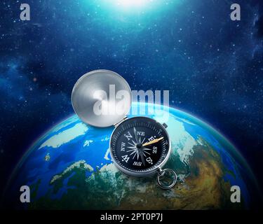 Compass nestled on blue earth in space colorful solar system. . Travel ...