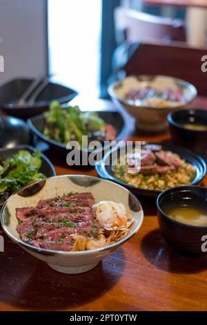 Steak Don, a Japanese dish consisting of a bowl of rice topped with ...