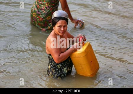 Burmese woman bathing & washing during Southeast Asia heatwave, life ...