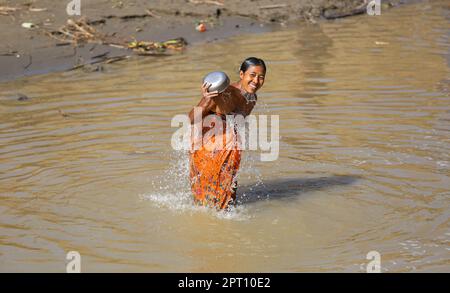 Burmese woman bathing & washing during Southeast Asia heatwave, life ...