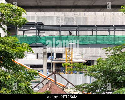 The unfinished metal frame of the sky walks bridge under the railway ...