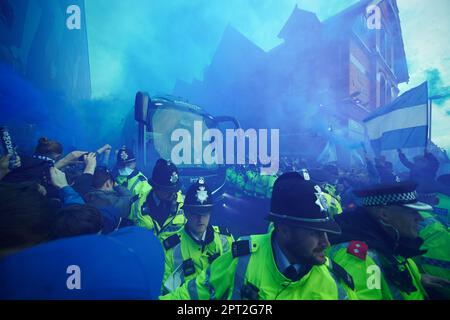 The Everton team bus arrives as police hold back Everton fans with ...