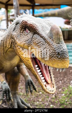 Rubber statue of a ferocious raptor dinosaur Stock Photo - Alamy
