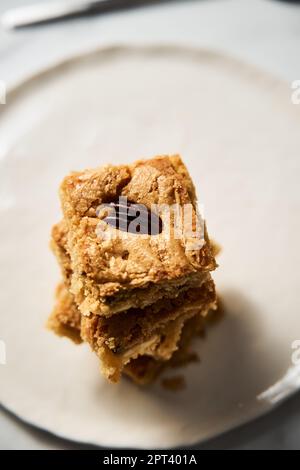 blondie cookies squares on white marble countertop background. White ...