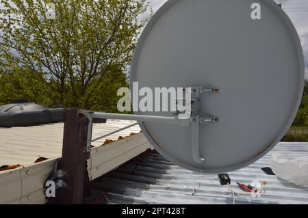 Installation and configuration of a satellite television a dish Stock ...