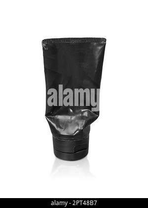 black plastic squeezed tube. Packaging for cosmetics on a white ...
