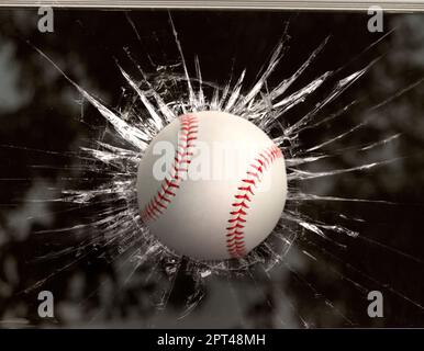 Baseball through broken window Stock Photo - Alamy