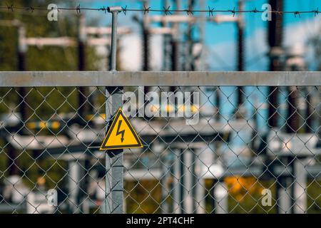 Electrical hazard sign placed on a fence of an electrical substation ...