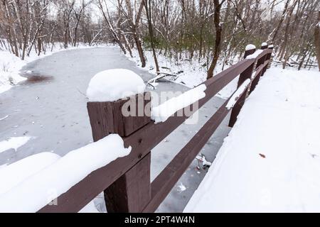 Rustic Bridge Over Frozen River In Winter Stock Photo - Alamy