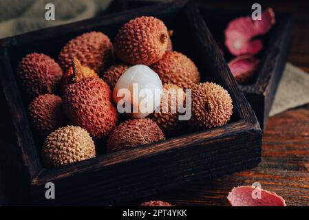 Delicious Fruits of Lychee in Rustic Box Stock Photo - Alamy