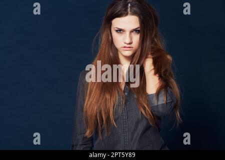 Magnetic glare. A beautiful model staring at you confidently while ...