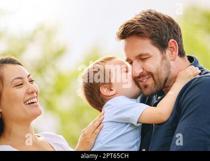 Guess who his favourite is. a young family spending time together at ...
