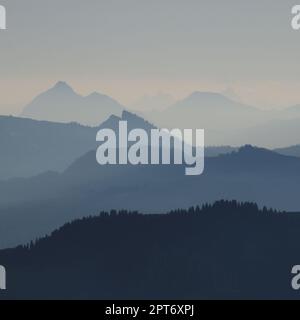 Layered mountain ranges in different shades of blue Stock Photo - Alamy