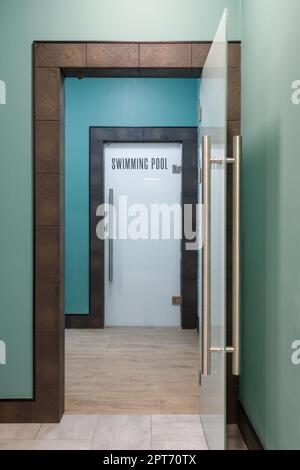 Closed stylish front door with inscription swimming pool in English ...